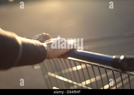 take cart in hands go shoping Stock Photo - Alamy