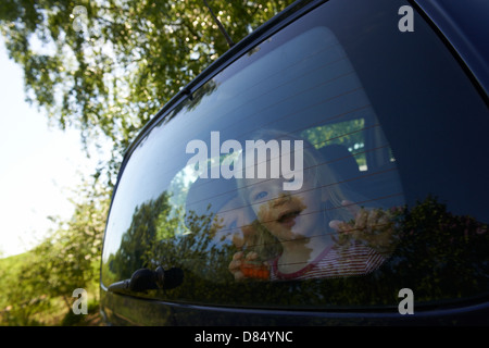 Kids bored in a car journey Stock Photo - Alamy