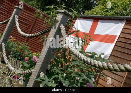 Garden decking posts in spring with rope loops Stock Photo - Alamy