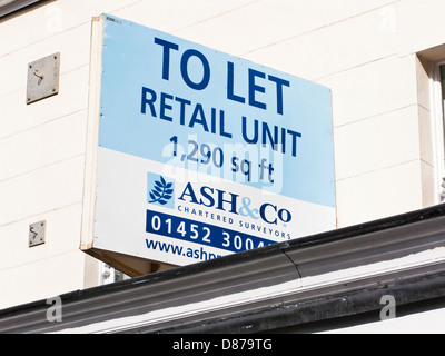 Retail unit to let estate agent advertising sign over vacant shop ...
