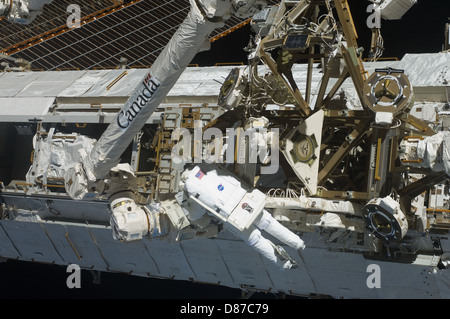 Robert Satcher performs an EVA (Extravehicular Activity) during the STS ...