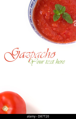 Red gazpacho made with tomatoes, papers and curry decorated with mint ...