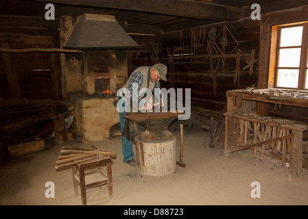 Blacksmith at work in smithy that comes from Żuromin town, now located ...