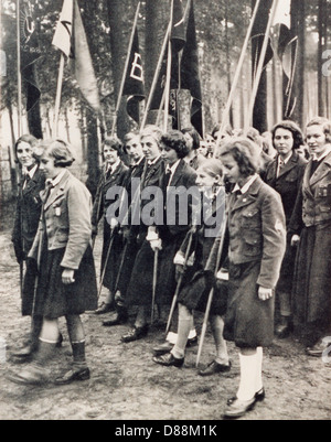 Members of the Bund Deutscher Mädel carry swastika flags during a ...