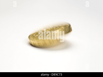A spinning British pound coin Stock Photo - Alamy