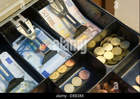 Cash money in drawer at a paydesk in a store Stock Photo - Alamy