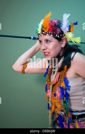 A Native American woman dances in full traditional regalia at the 8th ...