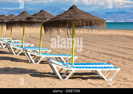 Line of Parasols at Spanish Winter Sand Beach. Horizontal shot Stock ...