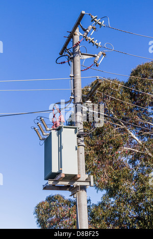 11 kV. overhead electrical power lines and transformer on wooden pole ...