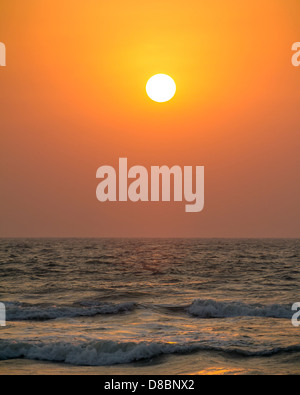 beautiful sunset over sea with sun rays between black clouds Stock ...