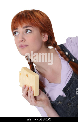 Woman eating gruyere Stock Photo - Alamy