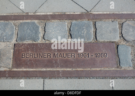 Historic route of the Berlin Wall Berliner Mauer marked by a sign on ...