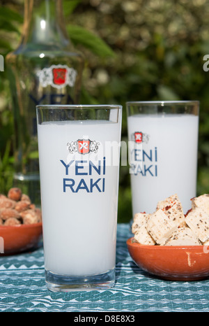Glasses of Turkish raki (a popular aniseed-flavoured spirit, known ...