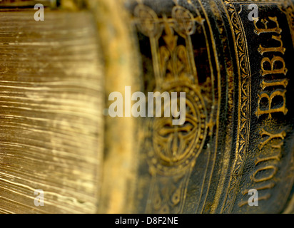 Spine of an old ancient holy bible Stock Photo - Alamy