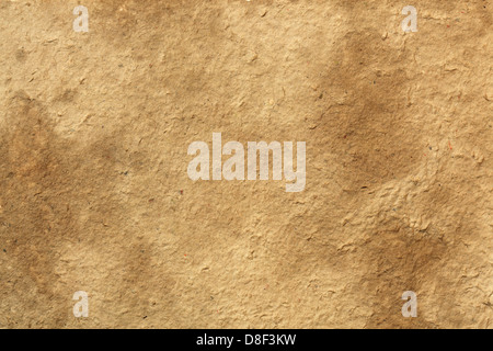 sheets of blank handmade paper with rough edges and a stylish pen ...