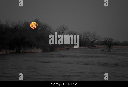 Kearney, Nebraska - A full moon sets over the Platte River Stock Photo ...