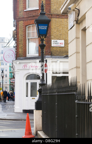 Traditional metropolitan police lamp post outside a police station ...