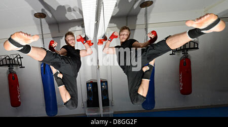 Police officer and kick boxing world champion Michael Smolik poses in ...