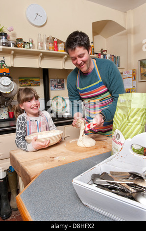 Father and daughter making bread in the rustic kitchen Stock Photo - Alamy