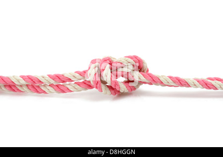 Closeup shot of a rope knot isolated on a peach color background Stock ...