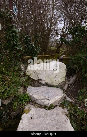 Large natural stone slabs forming a small bridge, steps and stile on a ...