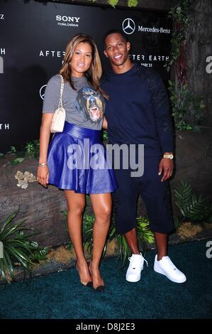 Elaina Watley and Victor Cruz at the premiere of 'The Hunger Games ...