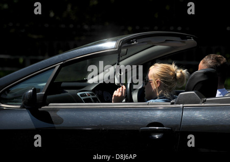 Woman smoking cigarette when driving Stock Photo - Alamy