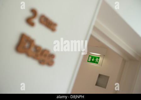 Emergency exit sign, illuminated pictograms, green, fire prevention ...