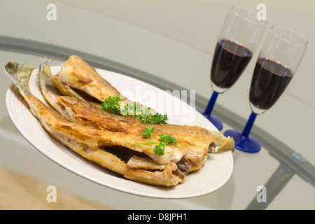 Pan fried pike perch fillet with crispy skin served in skillet, healthy ...