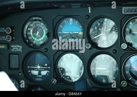 Close-up of a Cessna aircraft cockpit controls during a flight over ...