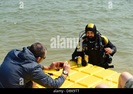 A diver smoking a cigarette Stock Photo - Alamy