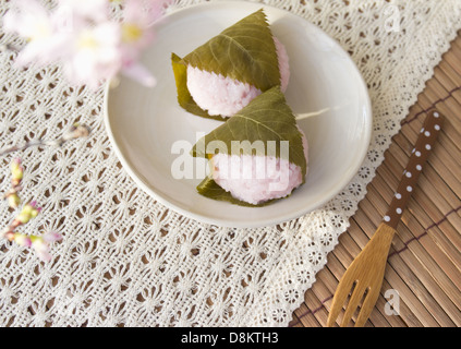 Sakura mochi (cherry flavored soft sweet rice cake Stock Photo - Alamy