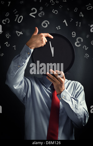 Businessman in time management concept Stock Photo - Alamy