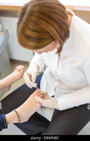 Foot care treatment at a salon in a modern setting Stock Photo - Alamy
