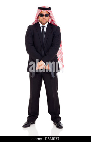 young middle eastern hitman posing with guns over black background ...
