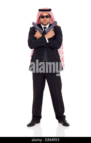 middle eastern bodyguard posing with guns on black background Stock ...