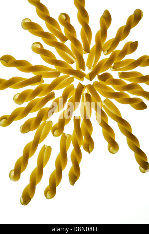 Pasta close-up. Fusilli spirale in a glass jar, isolated on white ...