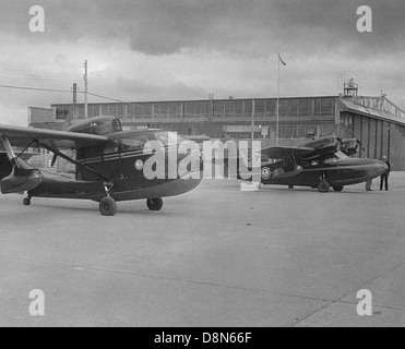 A photograph depicting an airfield, showcasing aircraft and aviation ...