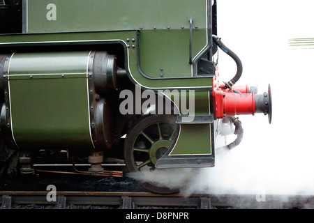 Close up detail of steam engine drive wheels and working parts on ...
