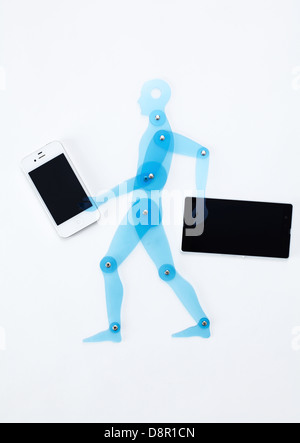 Human-shaped ruler holding smartphones Stock Photo - Alamy