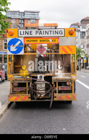 Painting new road markings on a newly resurfaced road Stock Photo - Alamy