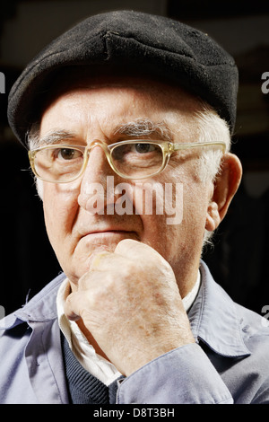 pensive man in eyeglasses looking away on sandy beach Stock Photo - Alamy