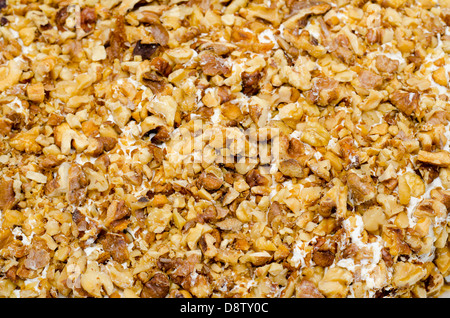 Crushed walnuts on white background Stock Photo - Alamy