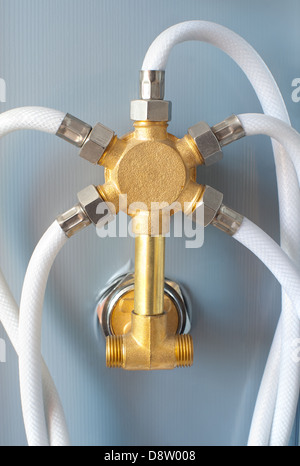 White plastic water pipe splitter isolated on white Stock Photo - Alamy