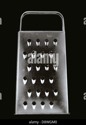 Metal grater, on color background Stock Photo - Alamy