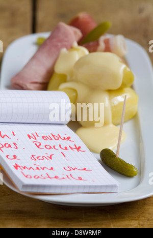 Raclette cheese and meat, a french tradition Stock Photo - Alamy