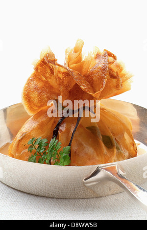 Scallop filo pastry purse Stock Photo - Alamy