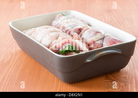 Raw meat with cooked stuffing for baking Stock Photo - Alamy