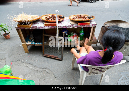 Selling Chestnuts in the Streets of Manila, Philippines Stock Photo - Alamy
