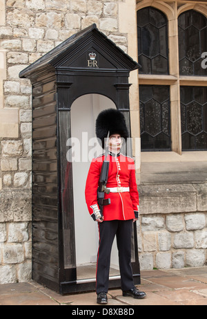 Welsh guard standing to attention in full ceremonial dress at the Tower ...